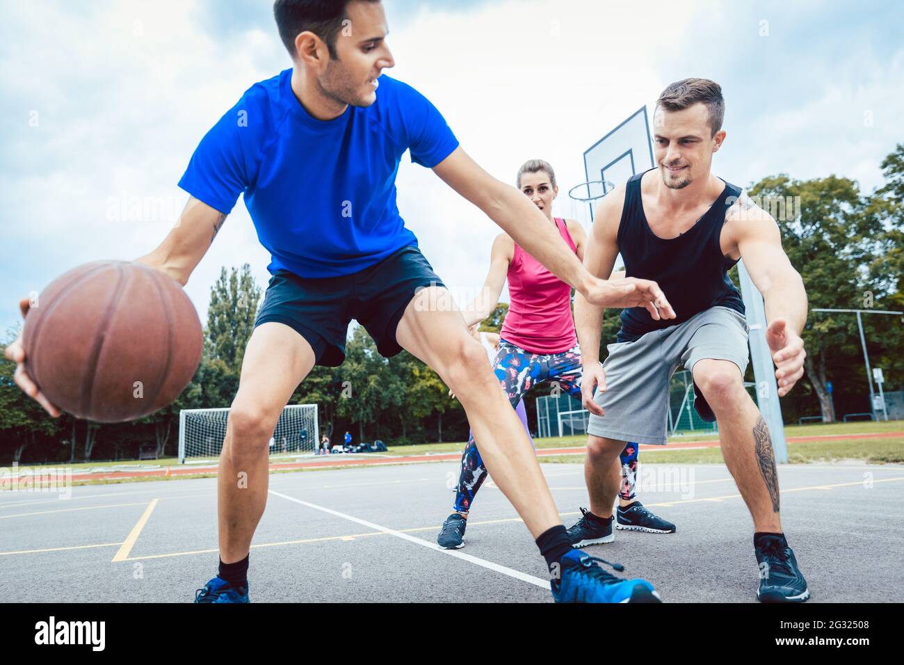 Basketball players practicing game at outdoor Stock Photo - Alamy