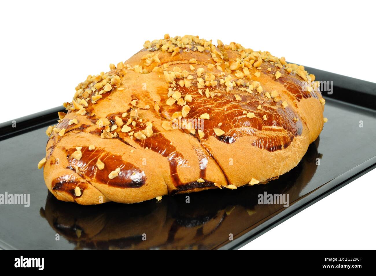 Fresh on a black plate paskalya coregi, challah, easter bun, isolated ...