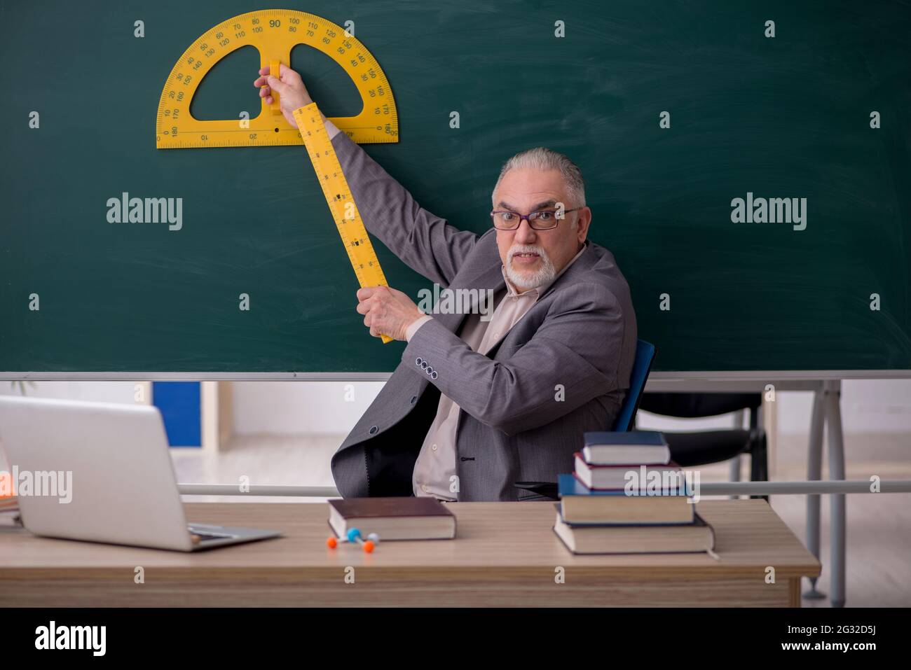 Angry teacher and ruler hi-res stock photography and images - Alamy