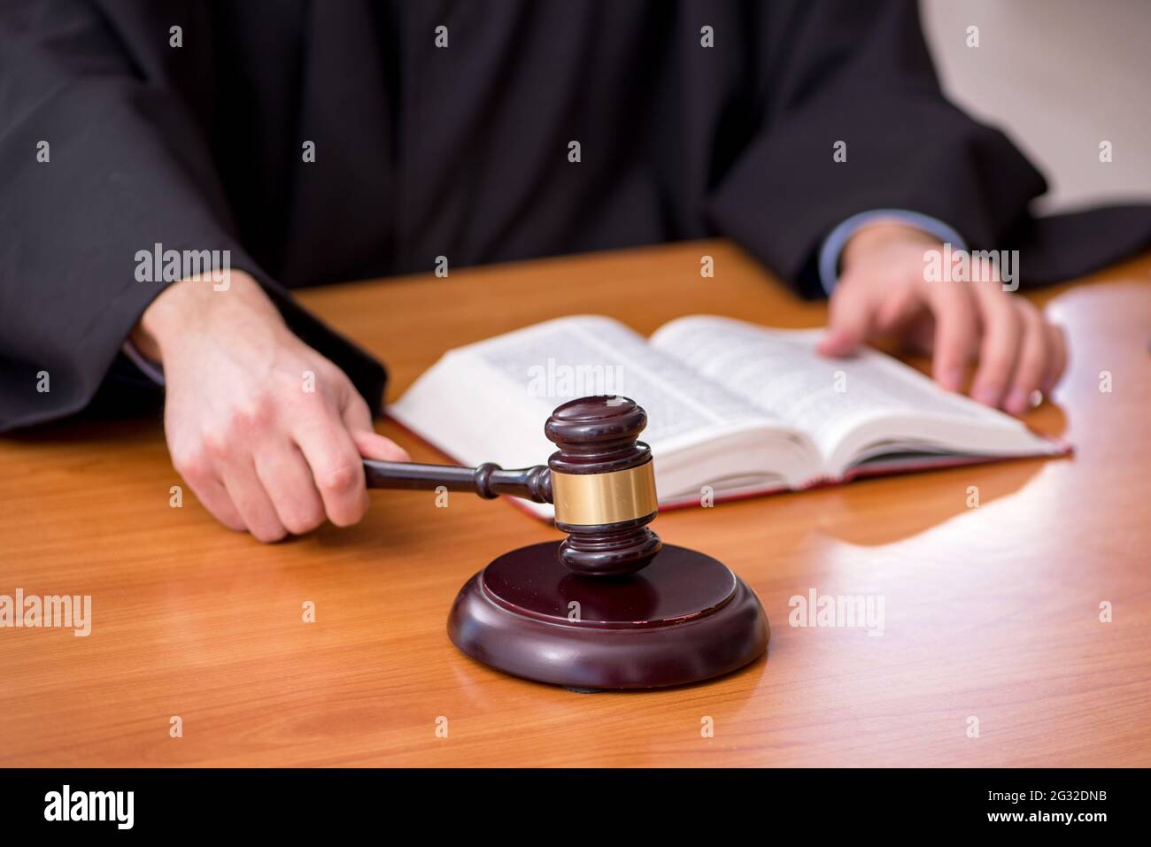 Young judge working in the courtroom Stock Photo - Alamy