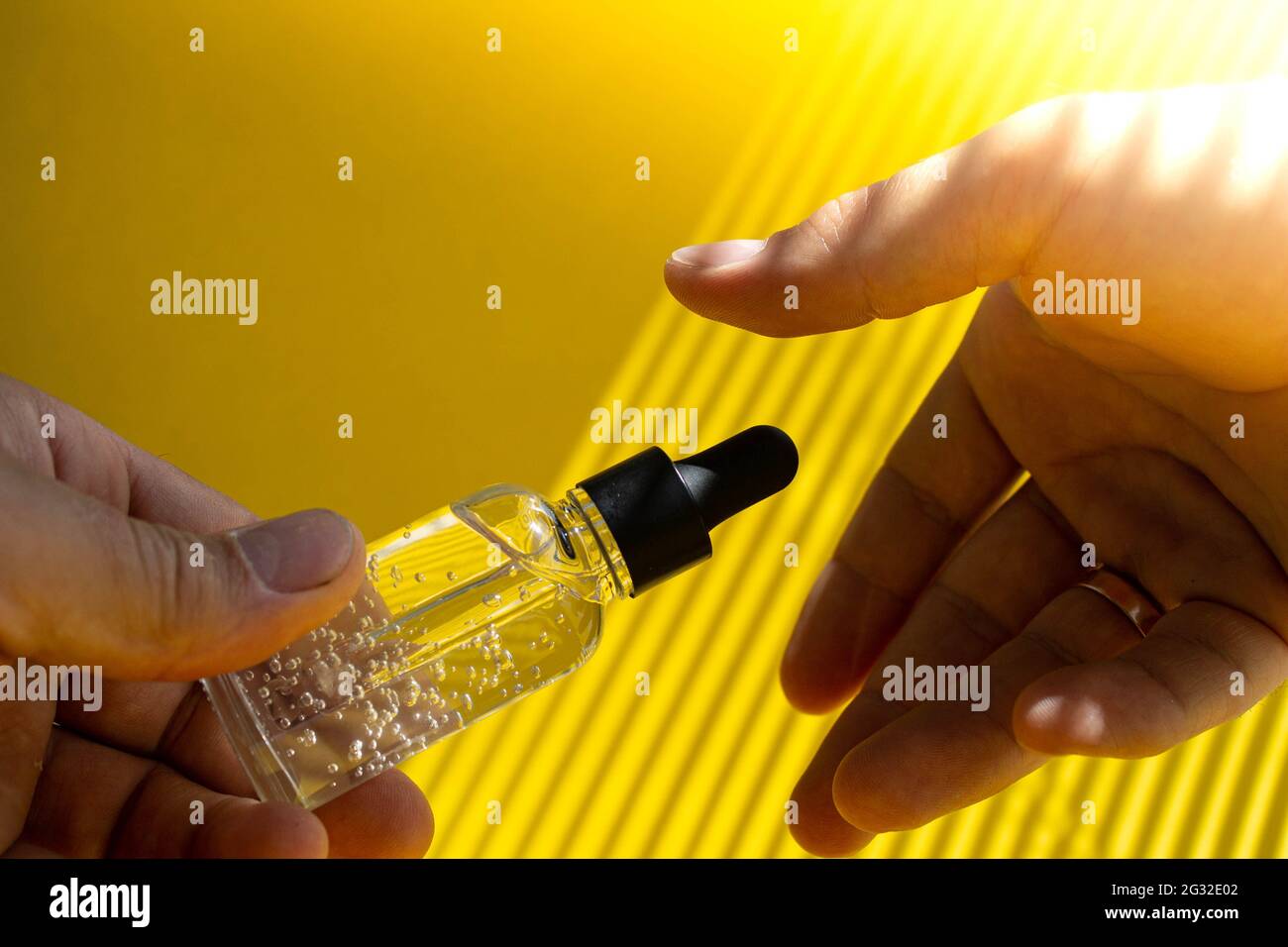 Hand-to-hand transfer of test tubes. Antibiotic in a test tube. Facial ...