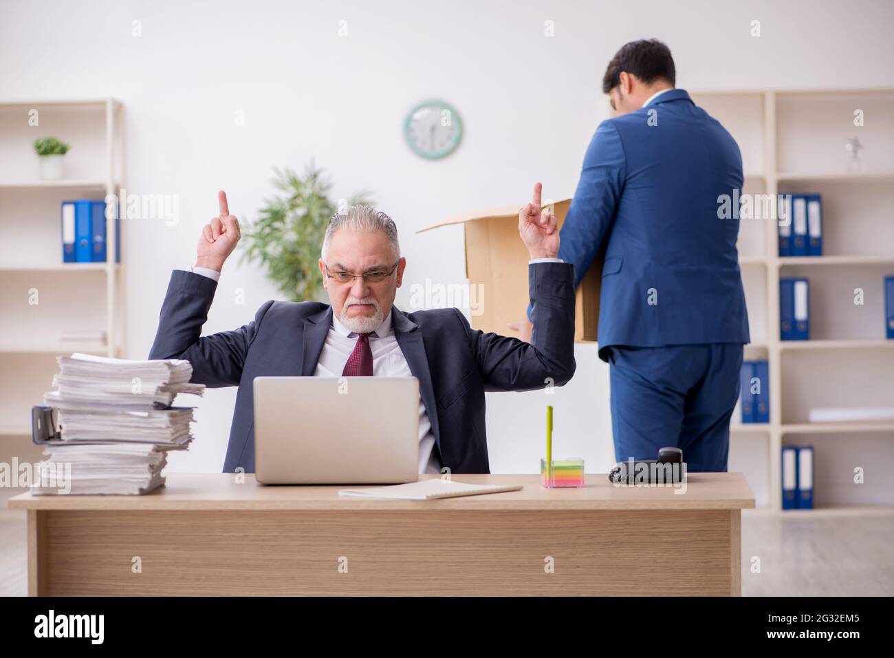 Two employees in dismissal concept Stock Photo - Alamy