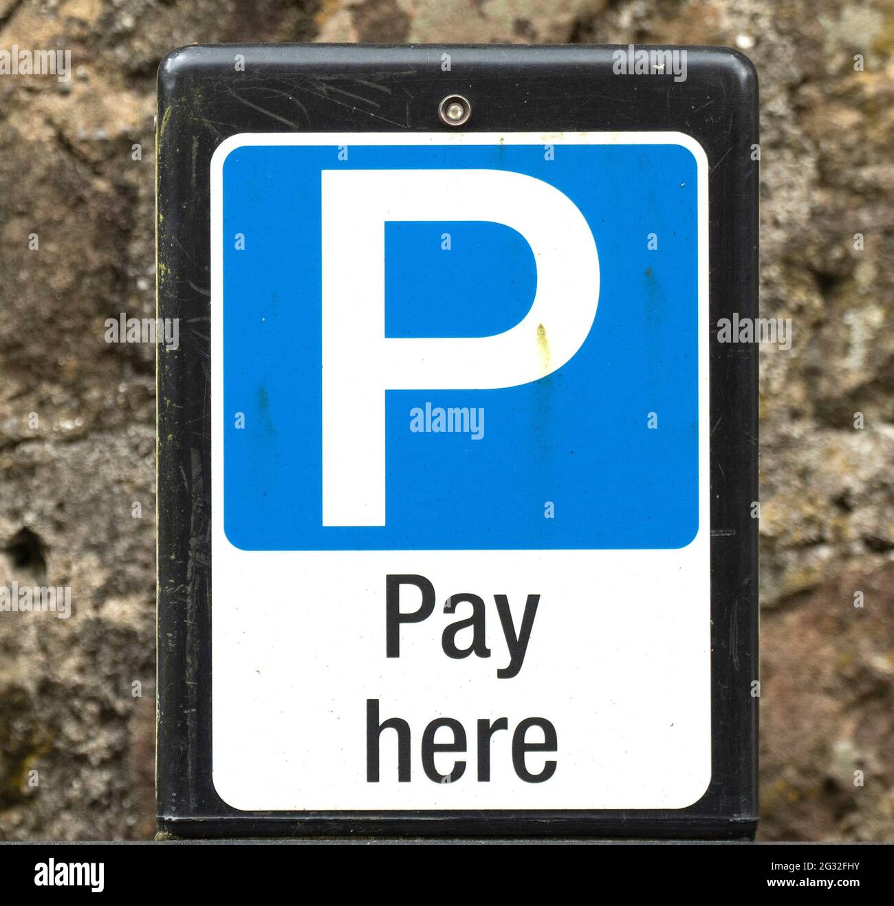 Parking payment sign on a wall Stock Photo - Alamy