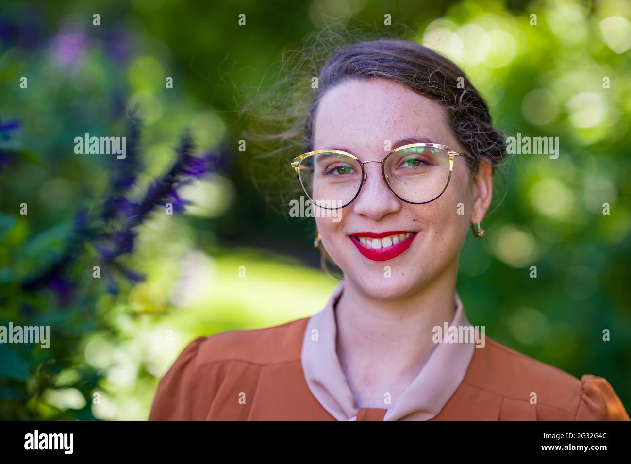 Young Intellectual Woman Dressed in 1940s Clothing In a Garden Stock ...