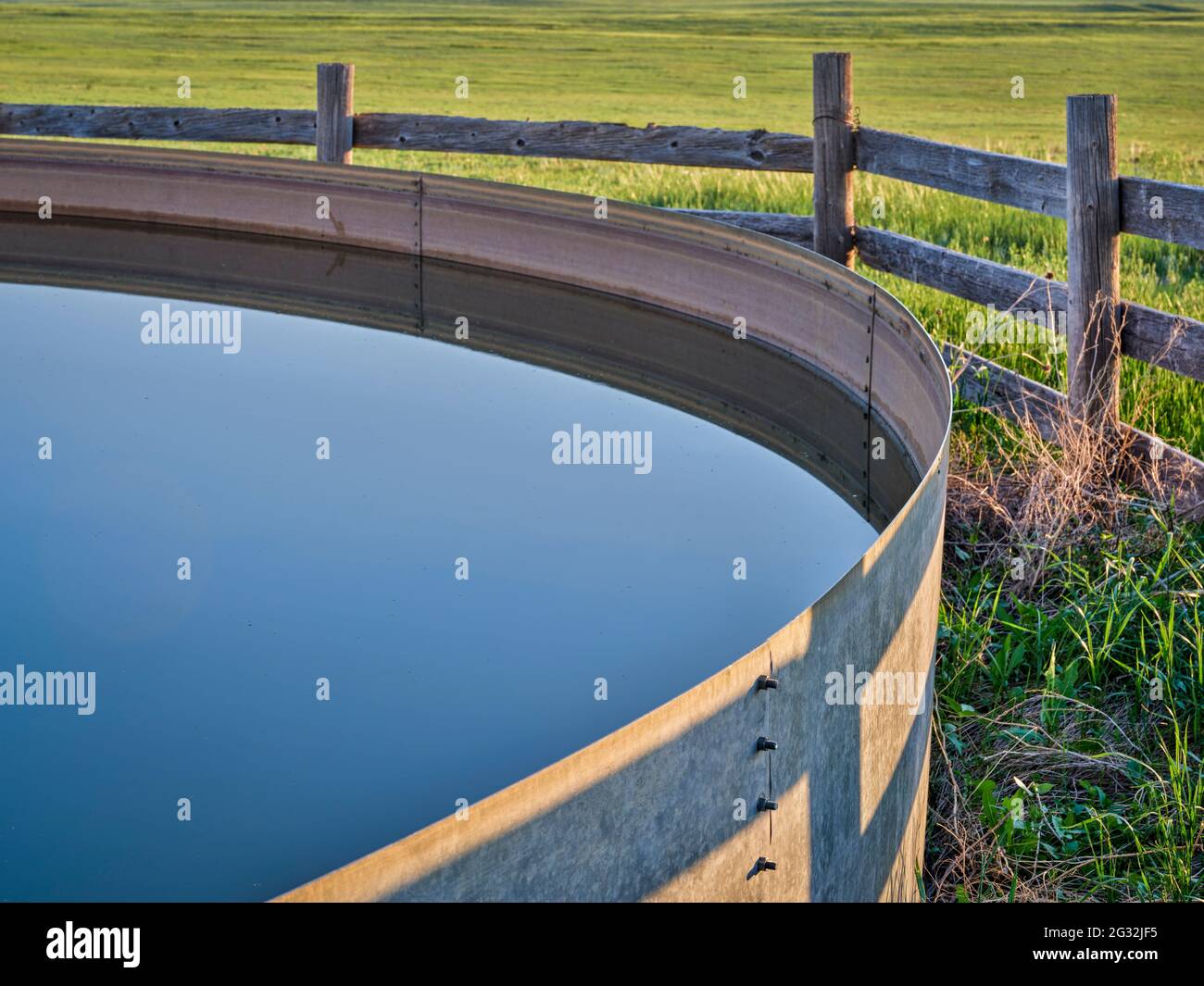 cattle water tank in a green prairie - Pawnee National Grassland in ...