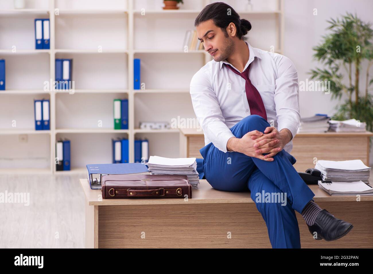 Extremely tired businessman male employee in the office Stock Photo - Alamy