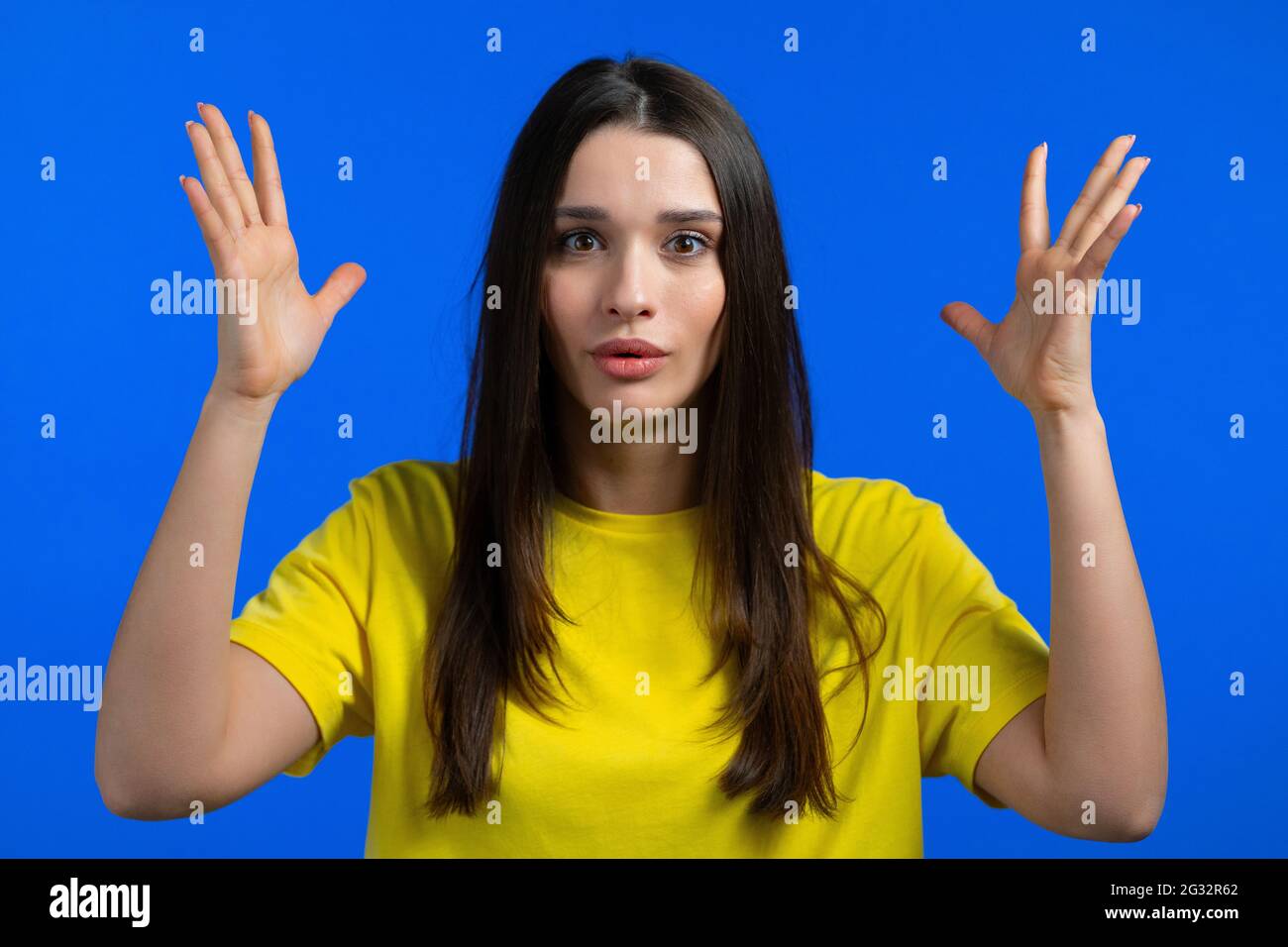 Young woman showing invisible abstract big subject or object. Large ...