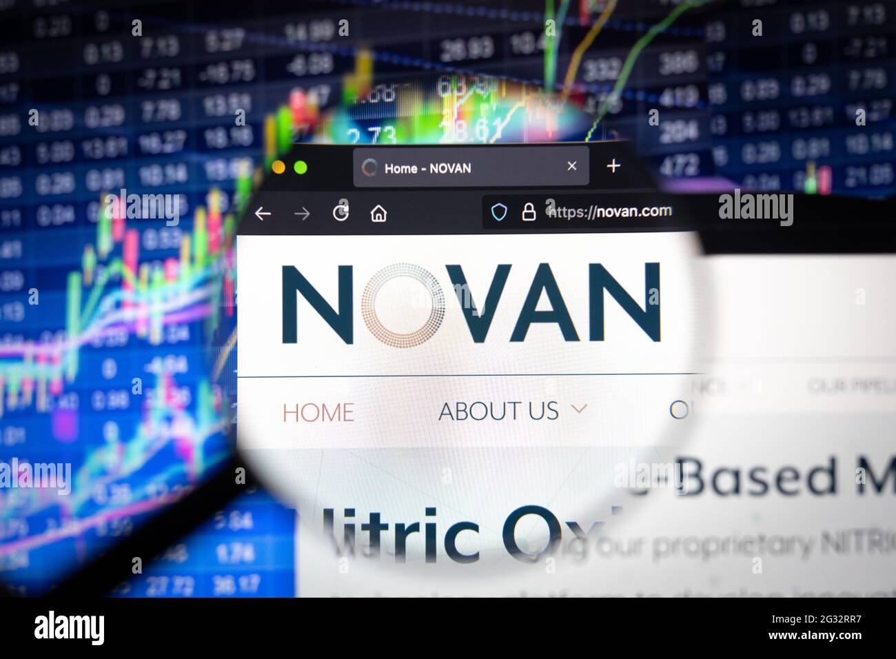 Novan company logo on a website with blurry stock market developments ...