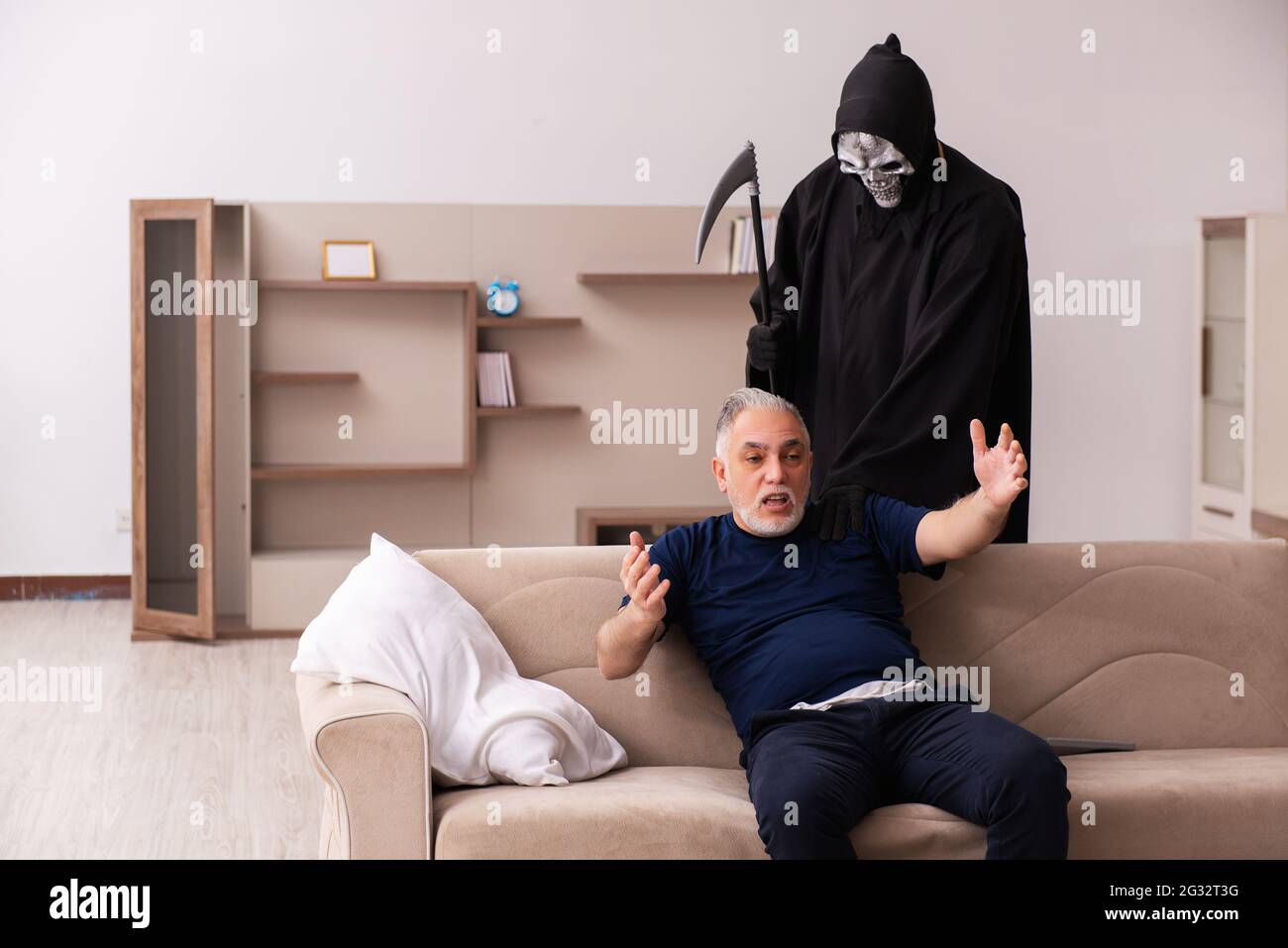 Devil coming to old dying man Stock Photo - Alamy