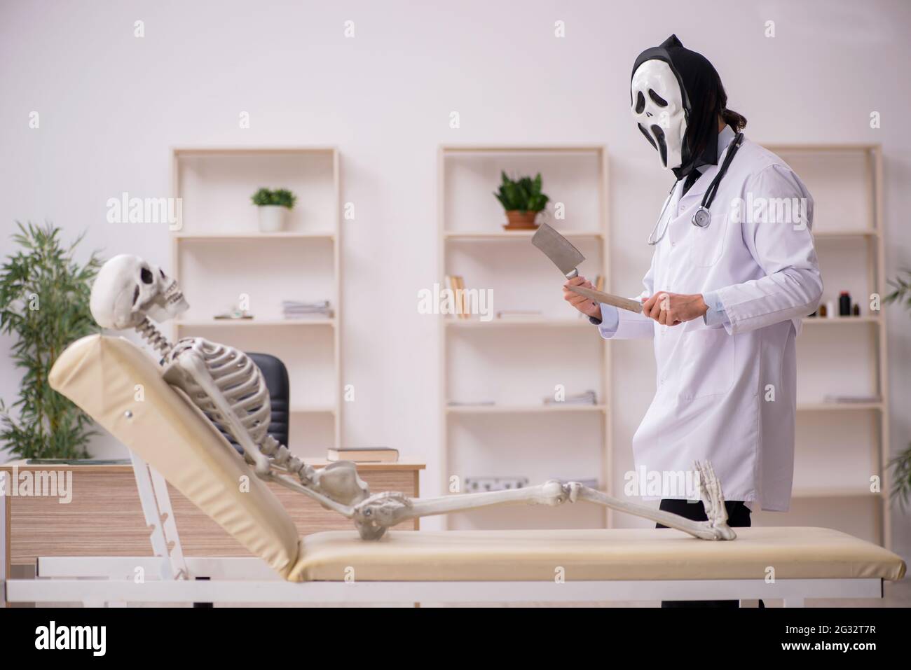 Devil doctor examining skeleton patient in the clinic Stock Photo - Alamy