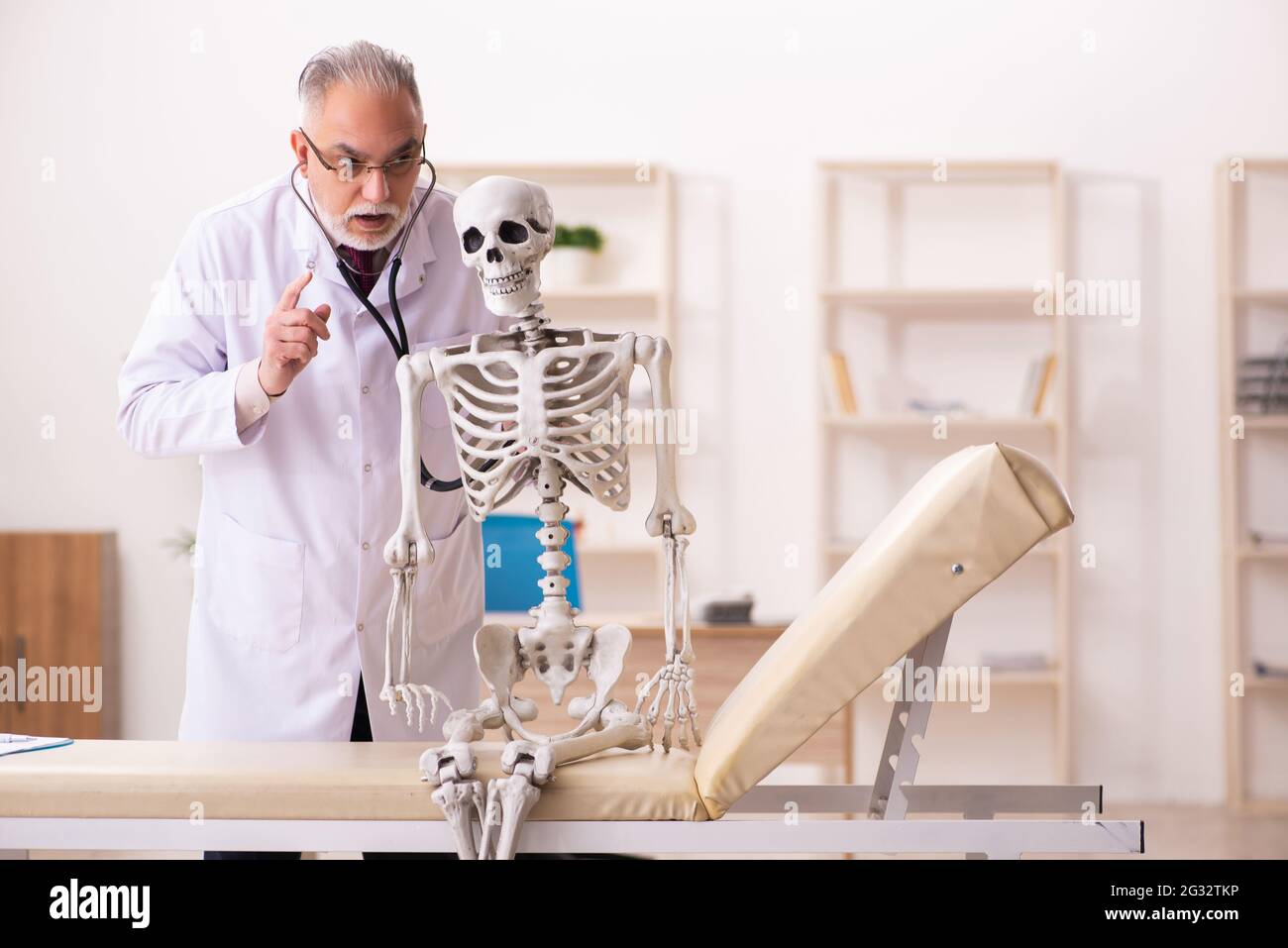 Skeleton patient visiting old male doctor Stock Photo - Alamy