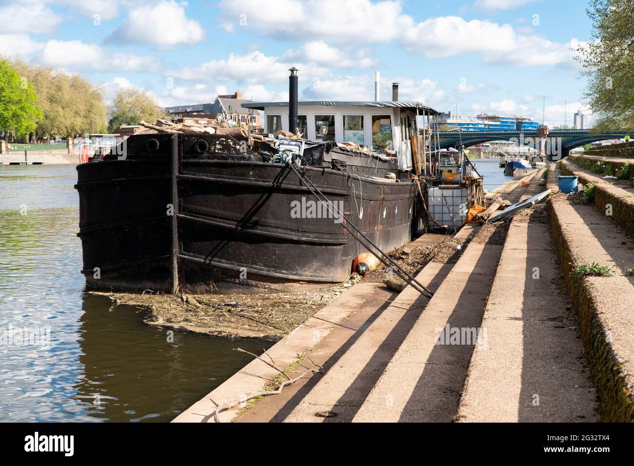 Big river barge moored on concrete steps Stock Photo - Alamy