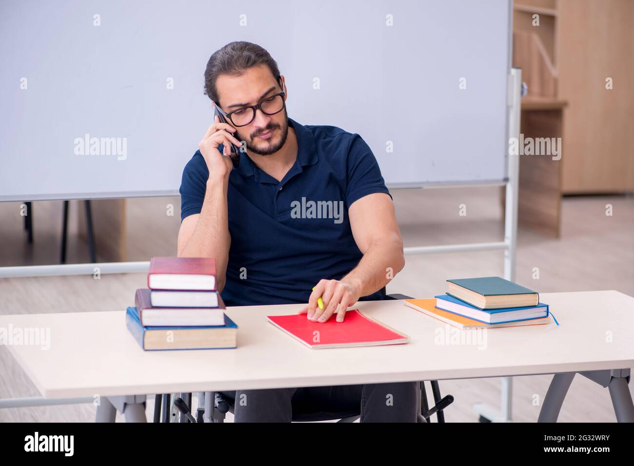 Young handicapped student in the classroom Stock Photo - Alamy
