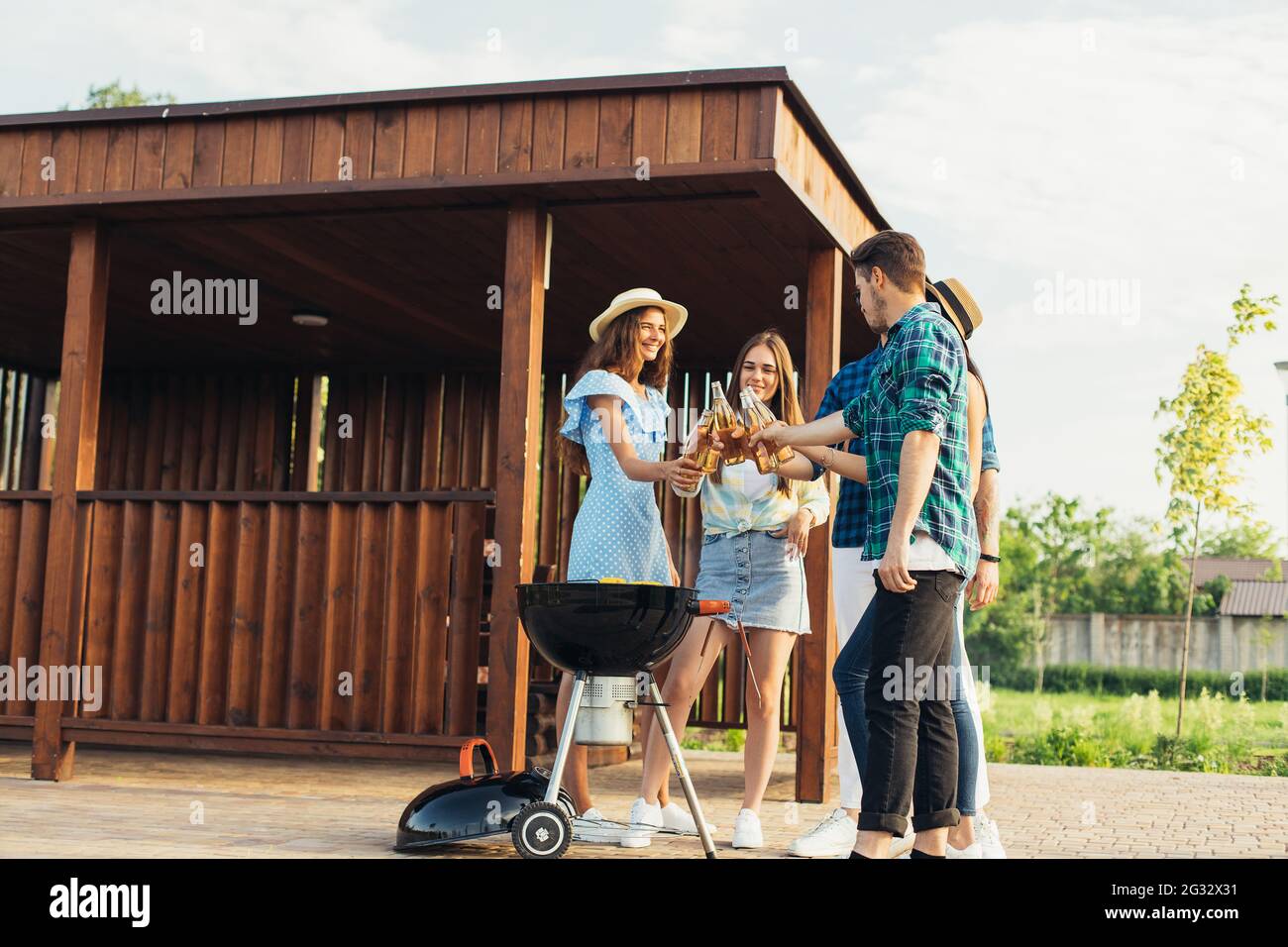 Group of young happy friends having barbecue party in nature, friends ...
