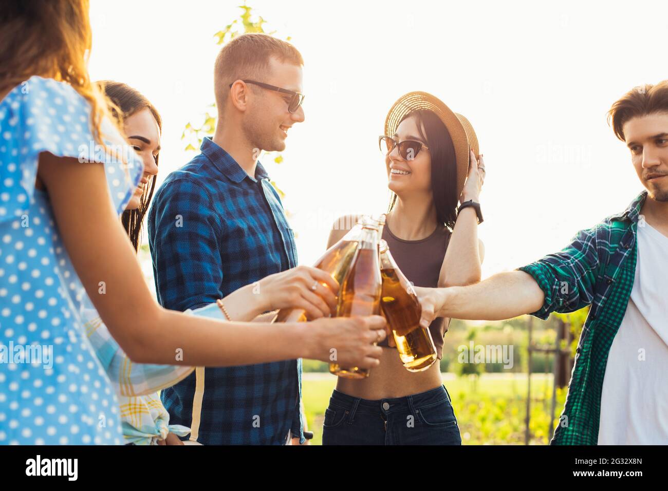 Group of cheerful young friends having a party, having fun drinking ...