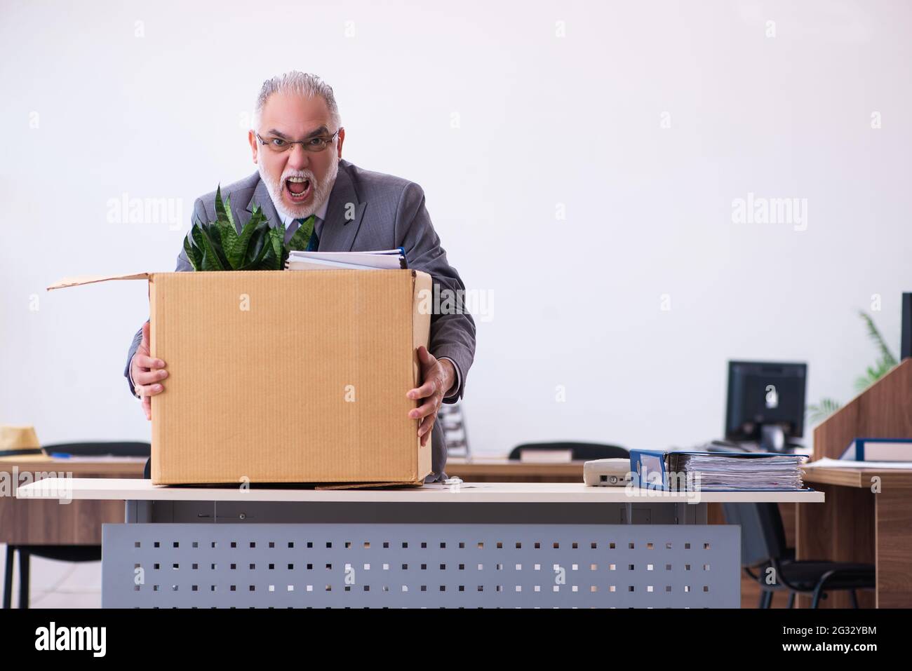 Old employee being fired from his work Stock Photo - Alamy