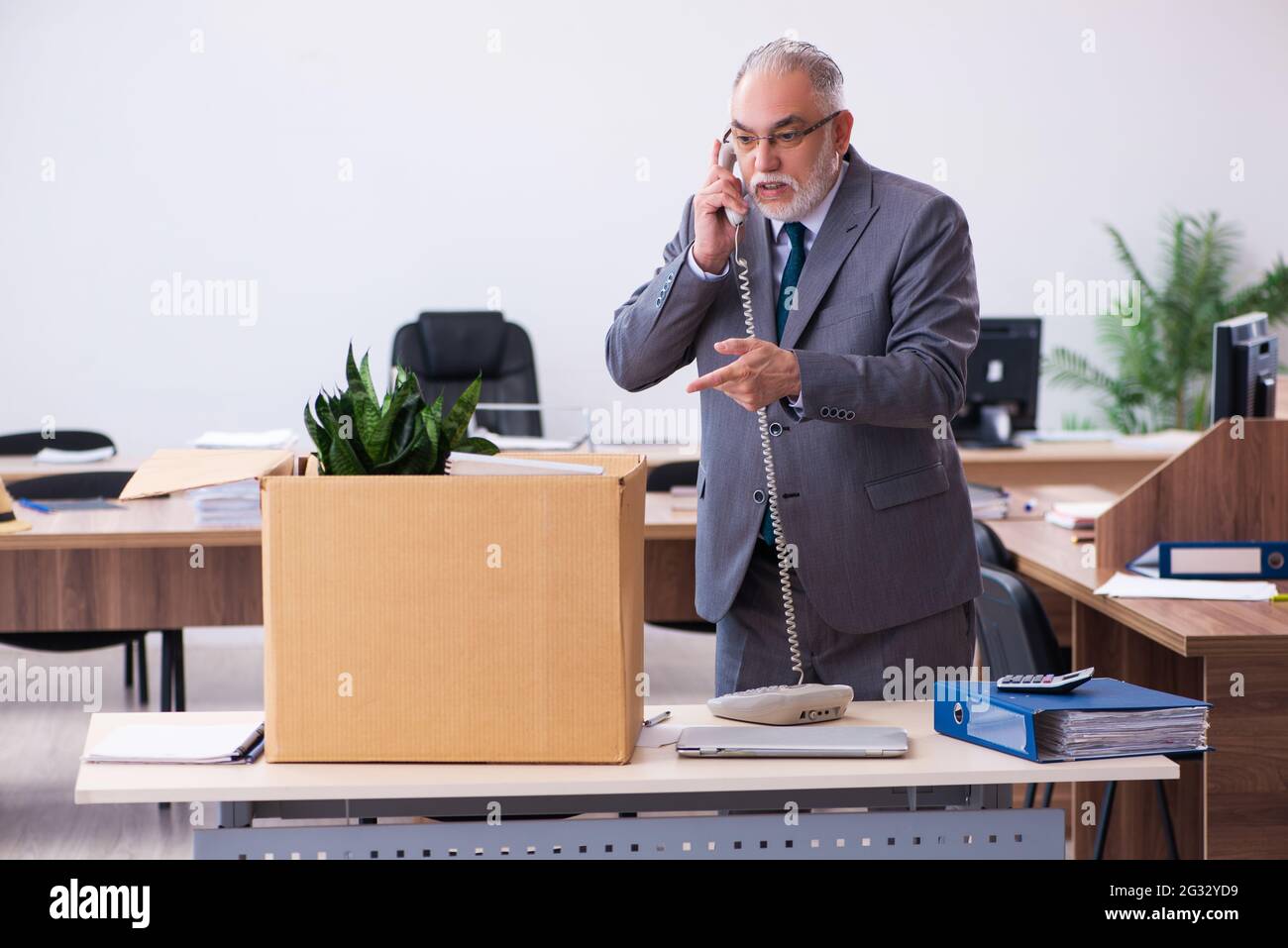 Old employee being fired from his work Stock Photo - Alamy