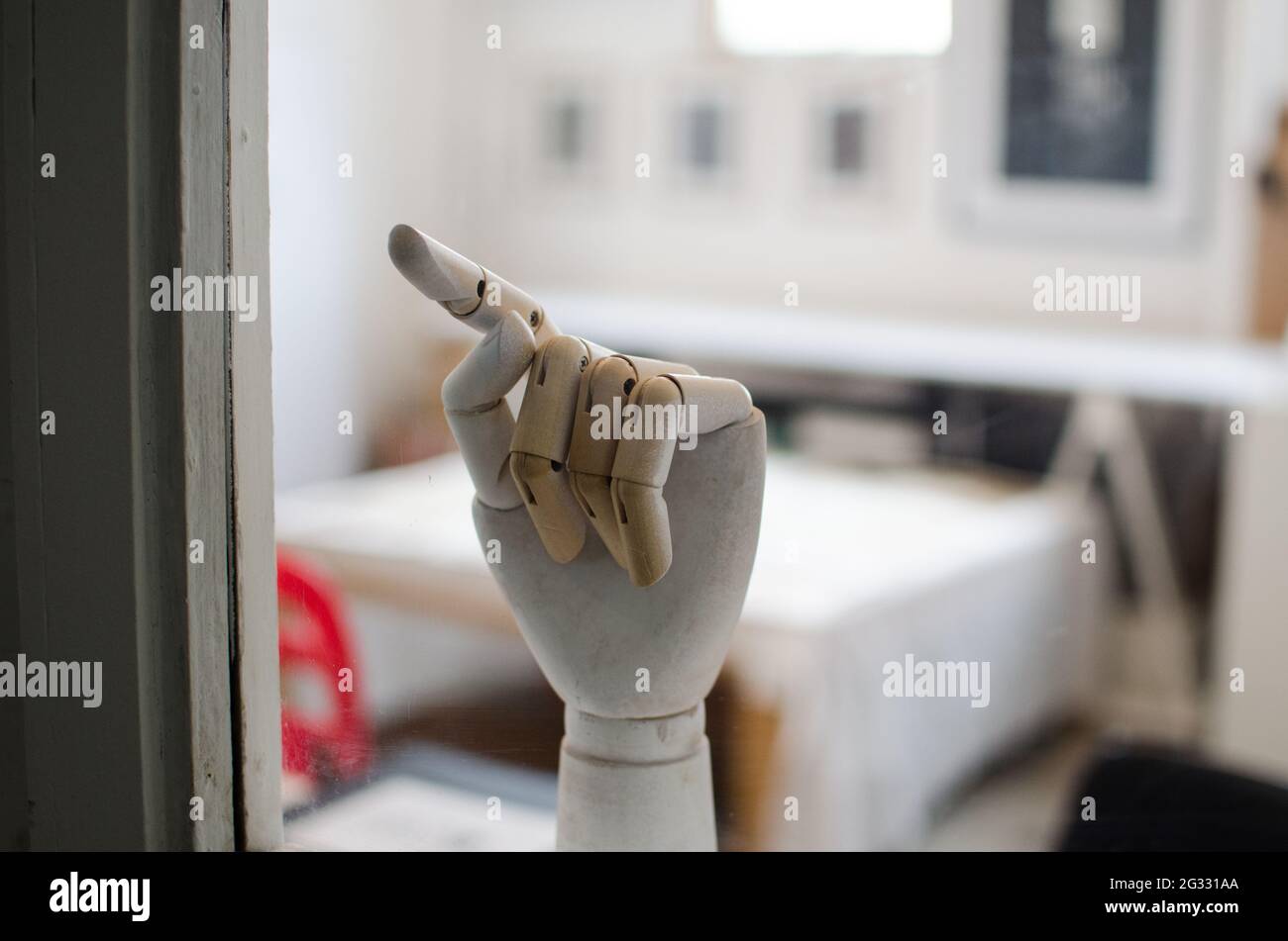 A closeup of a carved wooden hand with its pointed index finger Stock ...
