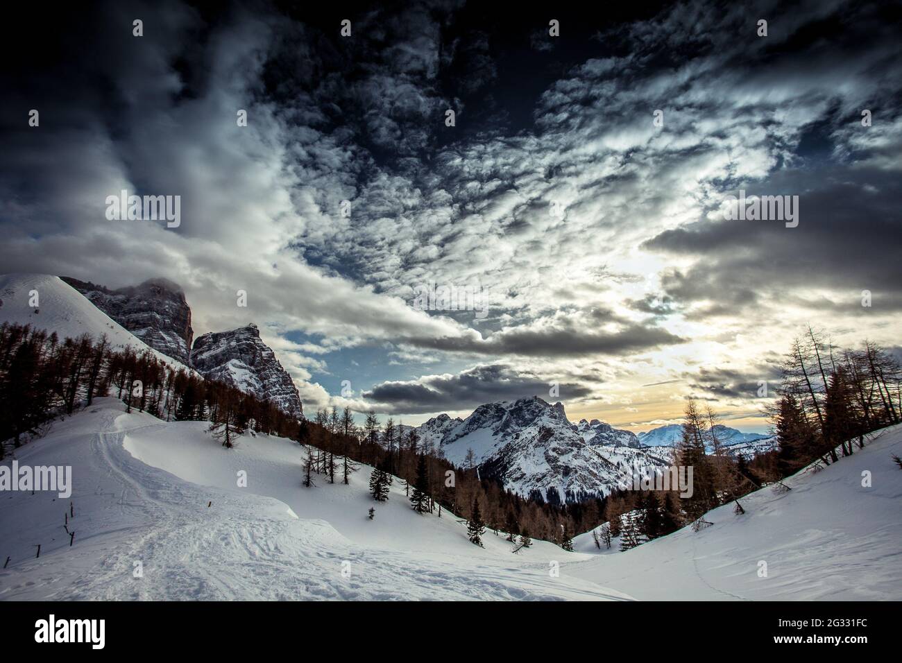Winter sunset panorama of Mount Pelmo and Mount Civetta with dramatic ...