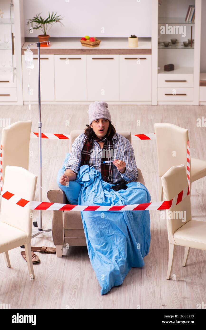 Sick man suffering at home in pandemic concept Stock Photo - Alamy