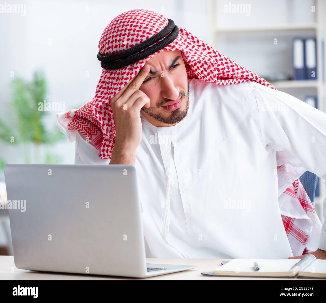 The arab businessman working in the office Stock Photo - Alamy