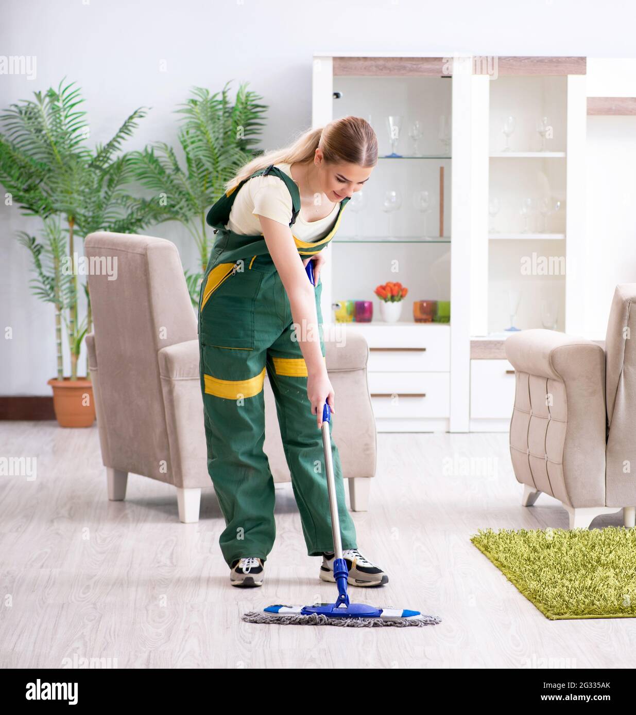 The woman female cleaner cleaning floor Stock Photo - Alamy