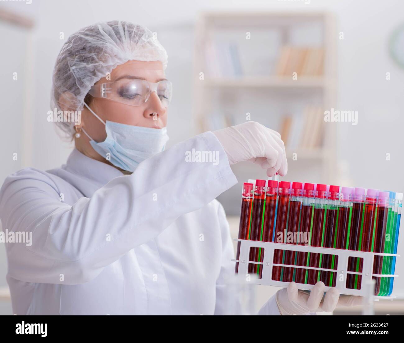 The woman doctor checking blood samples in lab Stock Photo - Alamy