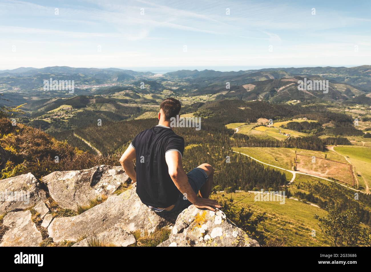 Young caucasian man at the top of Oiz mountain with amazing views all ...