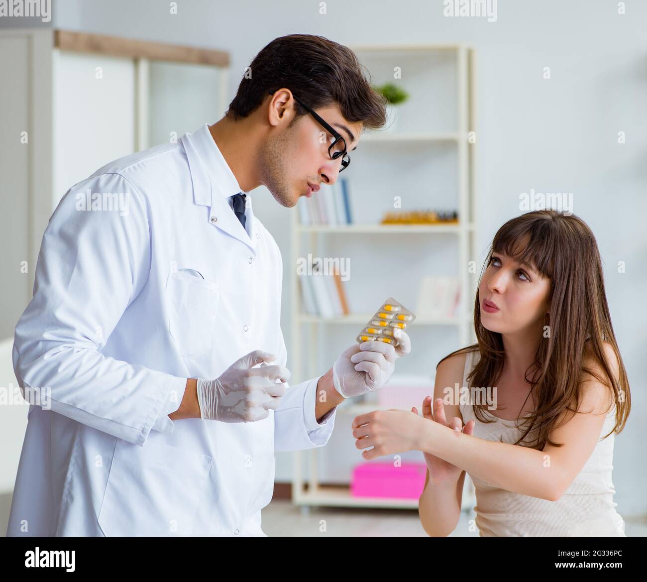 The doctor examining the skin of female patient Stock Photo - Alamy