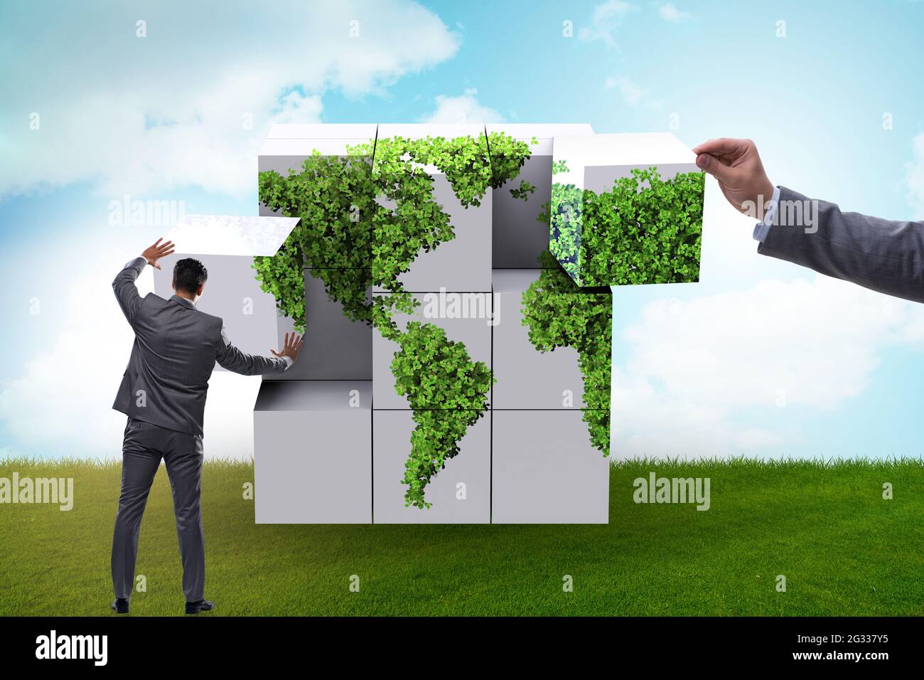 Businessman building world map from the cubes Stock Photo - Alamy
