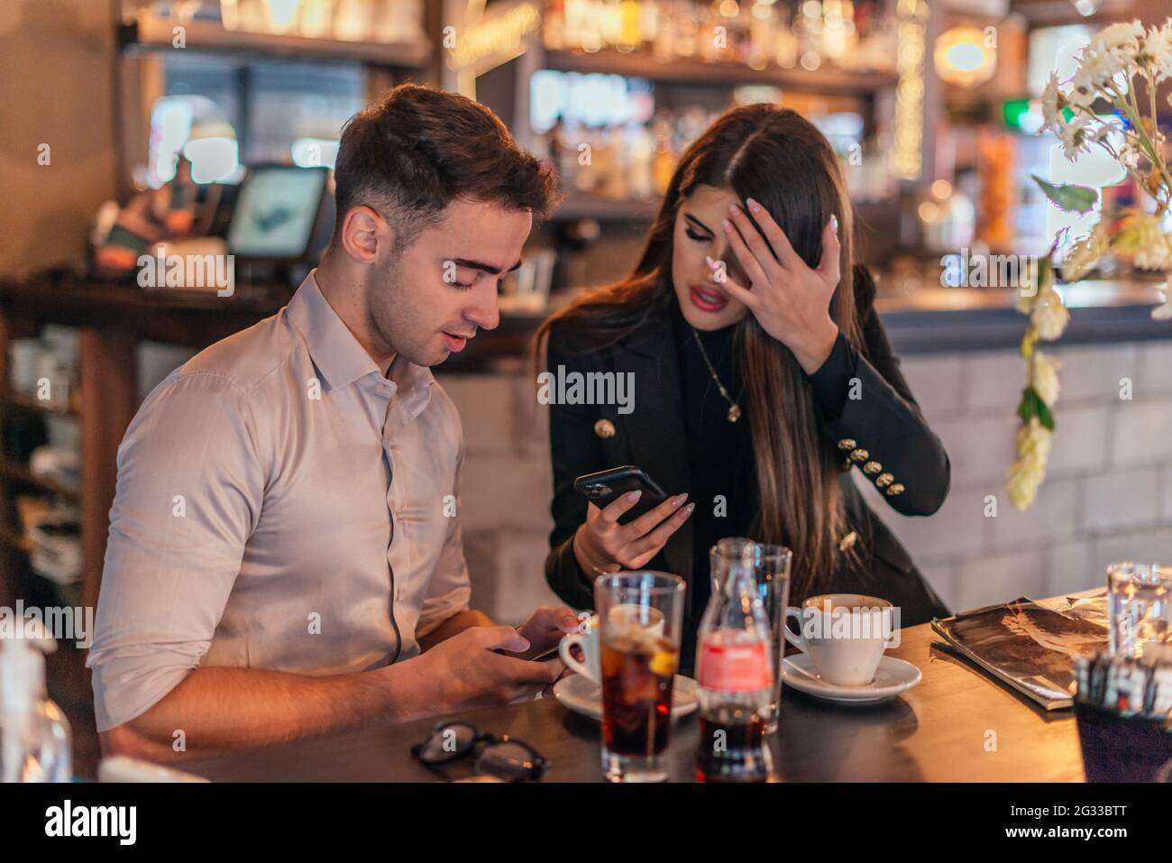 Close up picture of two business colleagues talking in a bar and ...