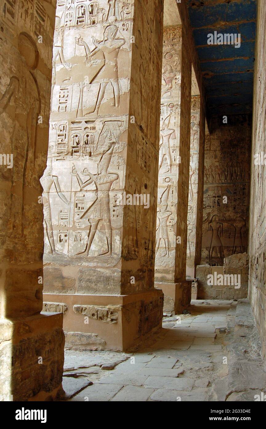 Interior colonnade with carved hieroglyphics and blue painted ceiling ...