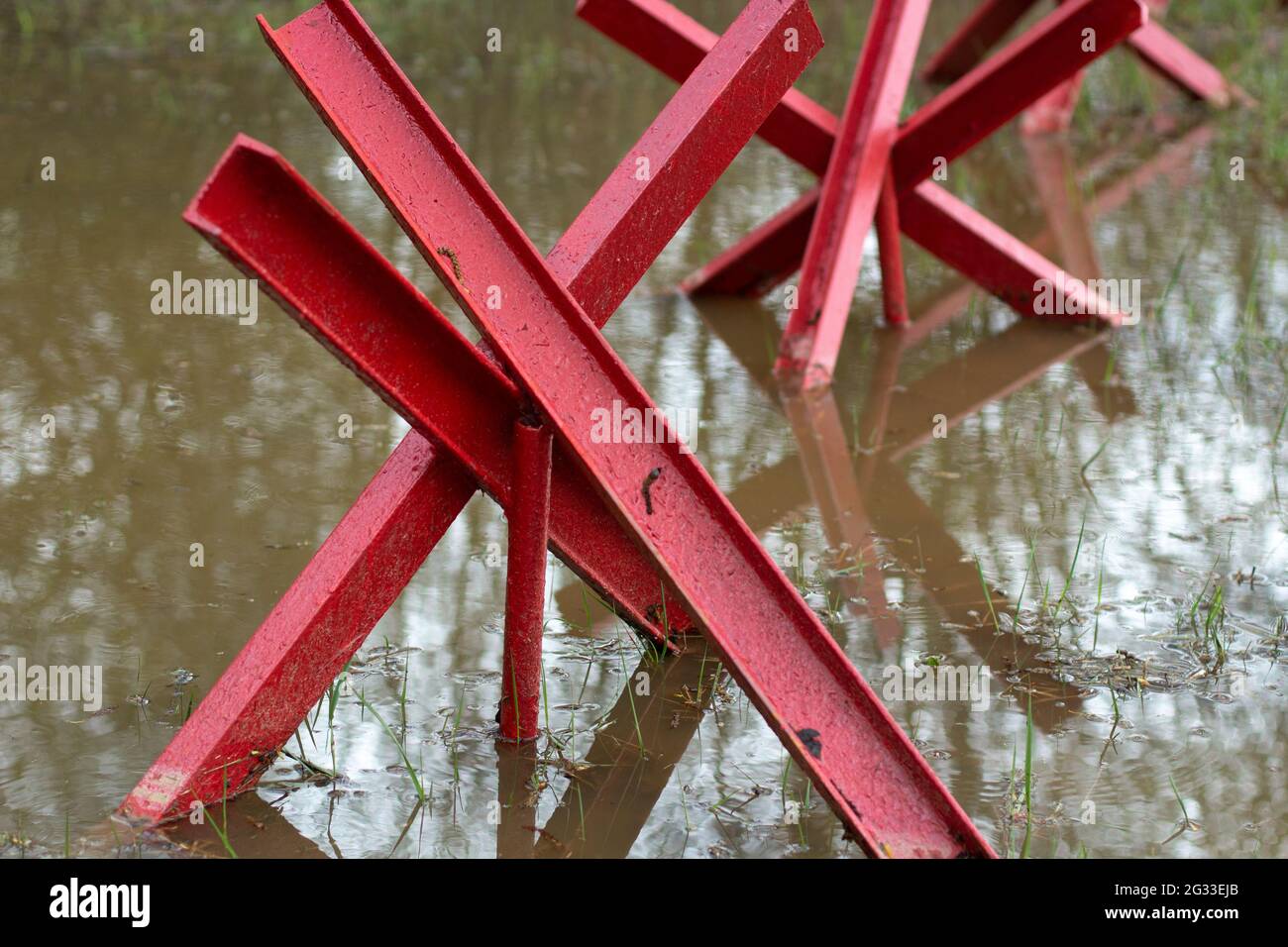 Anti-tank crosses are in the water. Barrage from military equipment ...