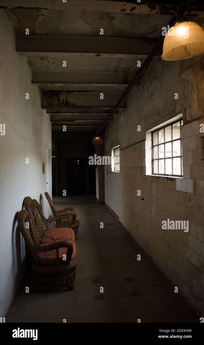 The corridor of an abandoned creepy old factory building with wooden ...