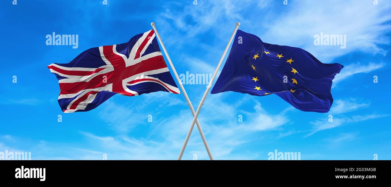 flags of great Britain and The European Union waving in the wind on ...