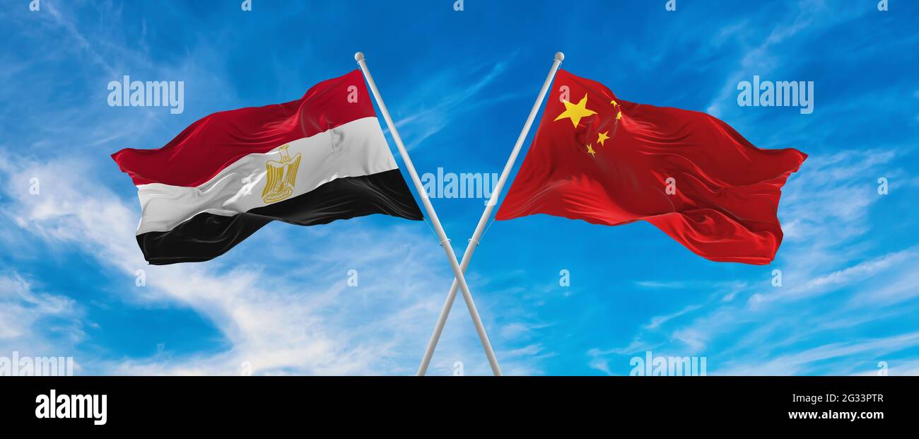 flags of China and Egypt waving in the wind on flagpoles against sky ...