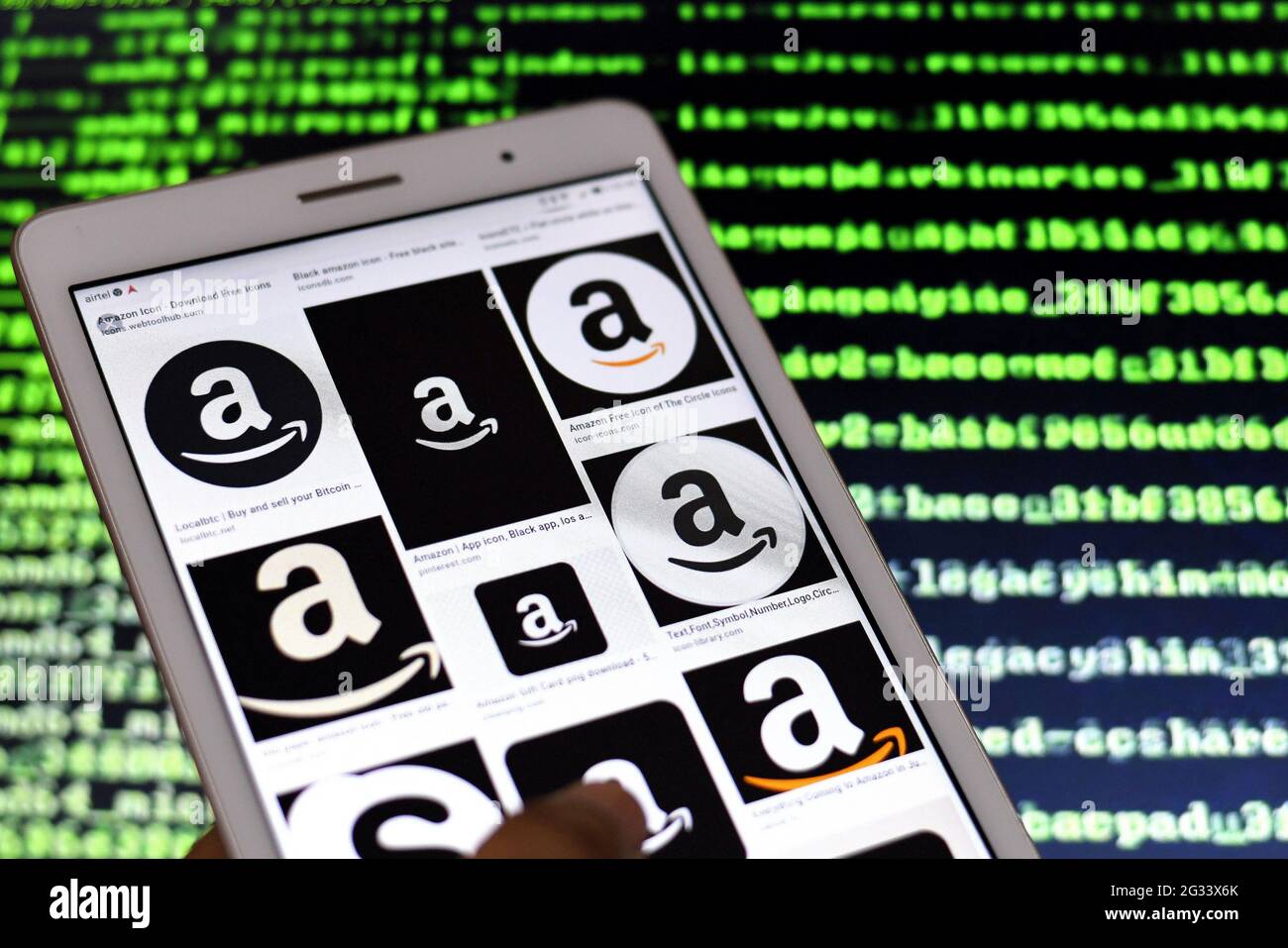 In this Photo illustration the Amazon Logos seen displayed on an ...