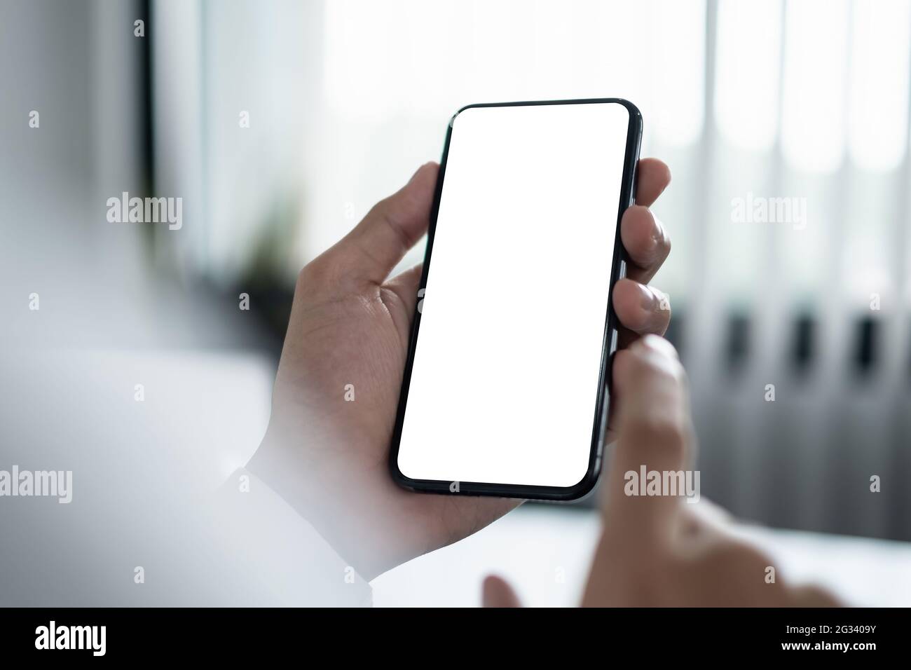 A Man hand holding smartphone device with blank screen Stock Photo - Alamy