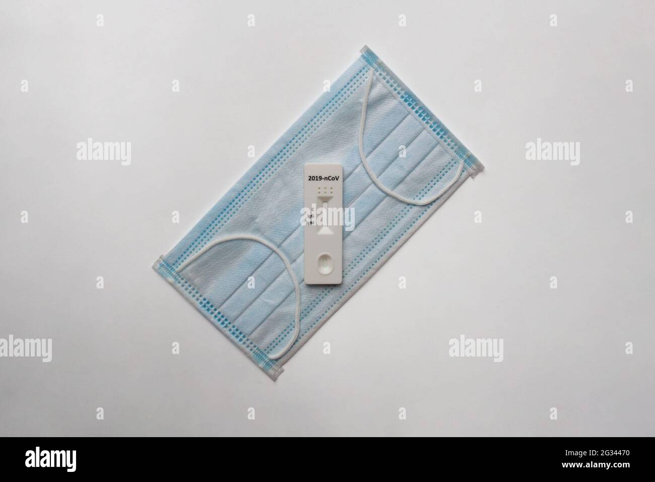 Covid-19 PCR test and medical face mask isolated on white background ...