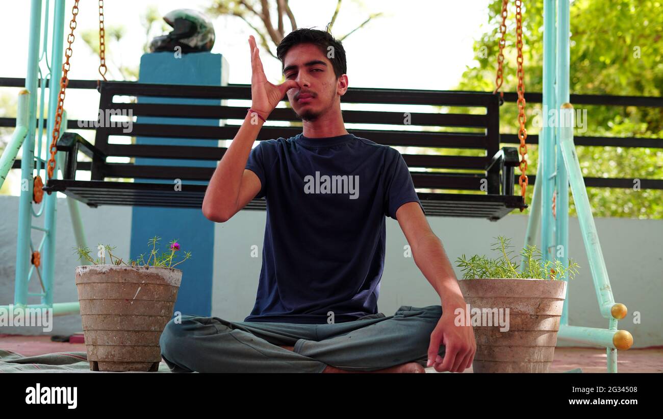 Indian young boy doing yoga at home. world yoga day. Concept of health ...
