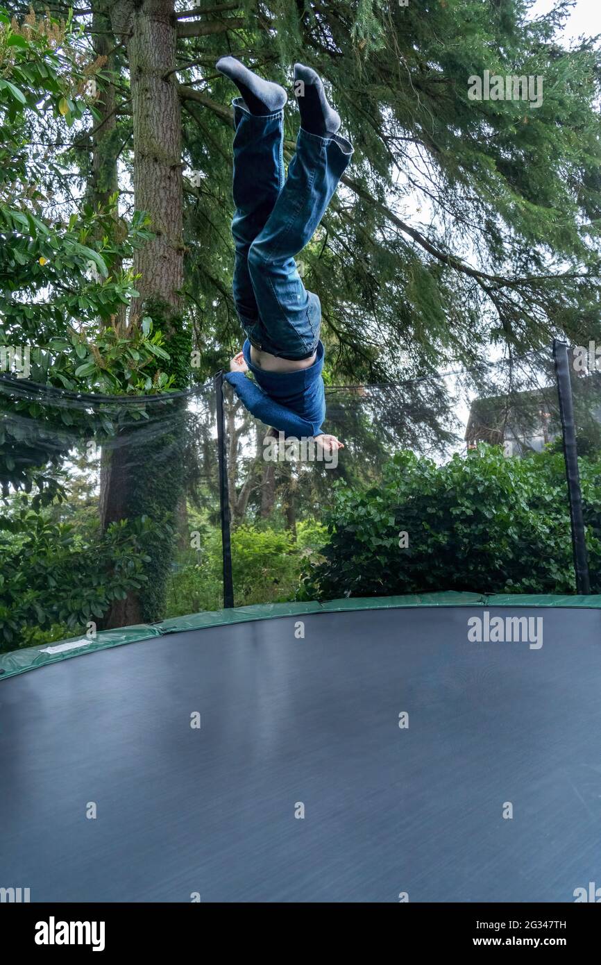 Lynwood, Washington, USA. 39 year old man jumping on his trampoline ...