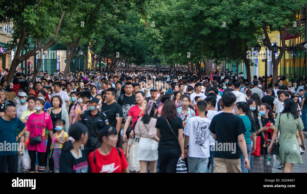 HARBIN, CHINA - JUNE 13, 2021 - People visit the central street of ...
