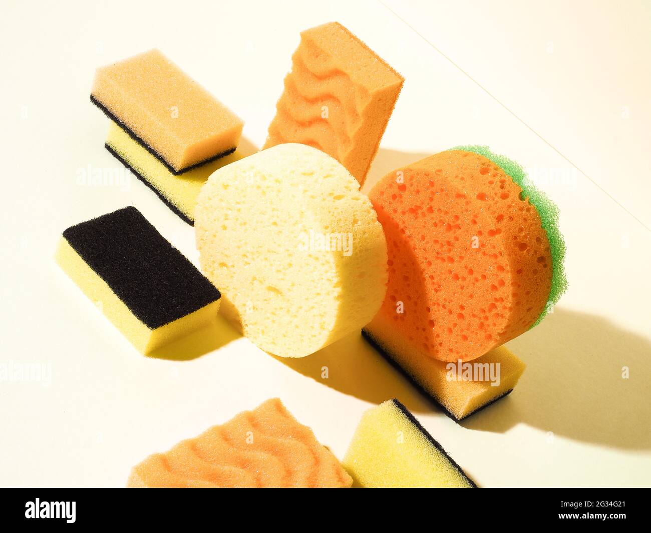 Composition with foam rubber sponges. Photo an angle. Yellow background ...