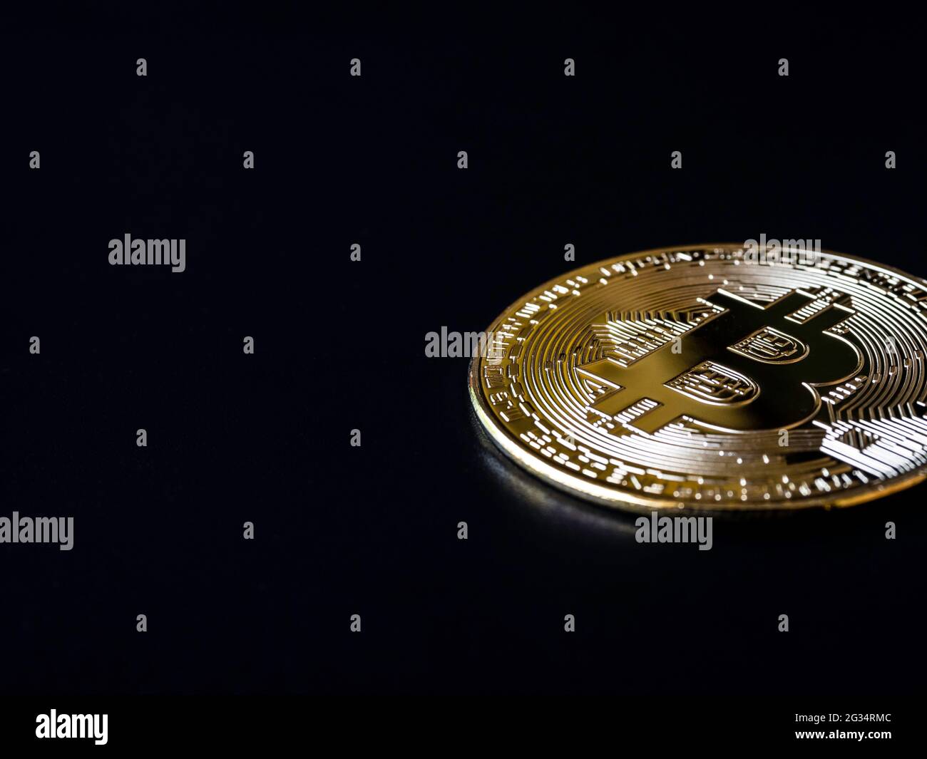 Bitcoin technology dark background. A golden bitcoin on black ...