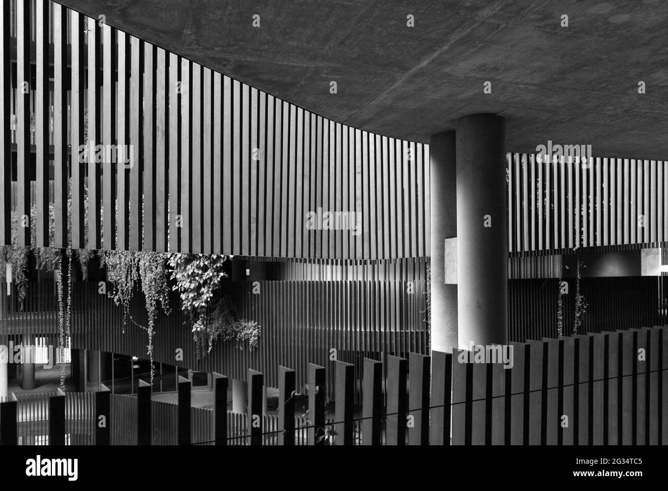 Grayscale shot of old and rustic metal structures in an abandoned ...