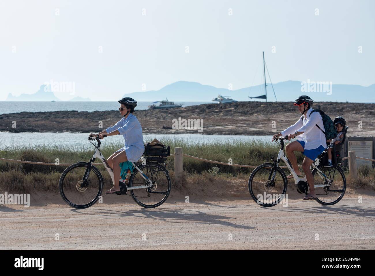 Formentera, Spain: 2021 June 13: Tourists cycling on the Illetes Beach ...