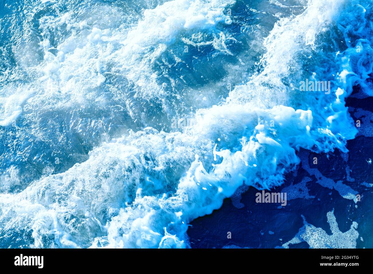 Areal shot of deep blue and rough sea with lot of sea spray.Blue ...