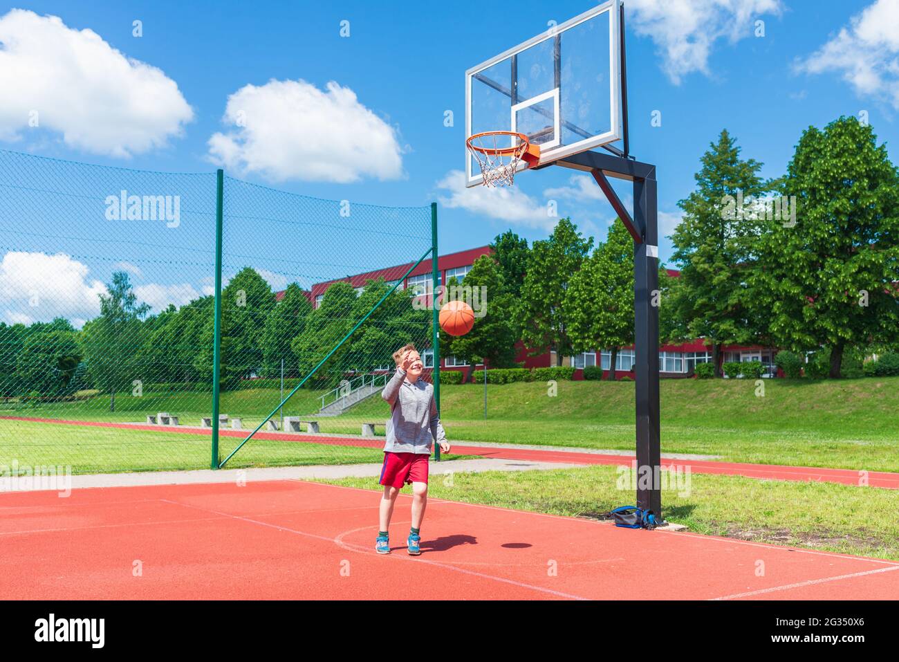 Kid Playing Basketball Alone