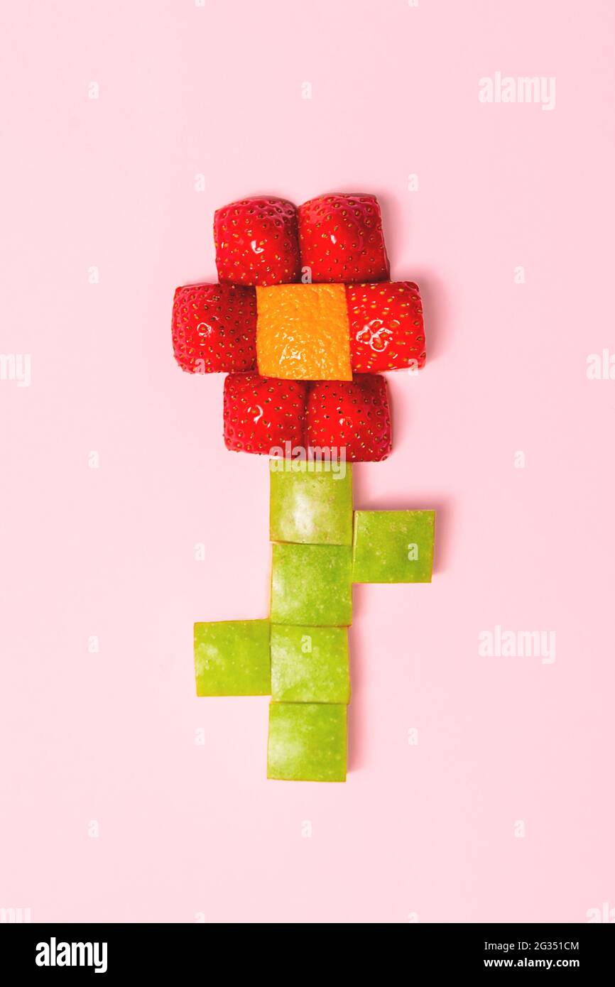 Flower in the technique of voxel art from fruits. Healthy food and ...