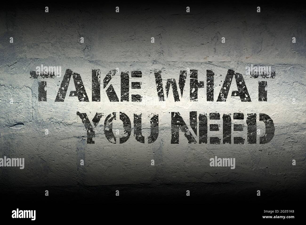 take what you need phrase stencil print on the grunge white brick wall ...